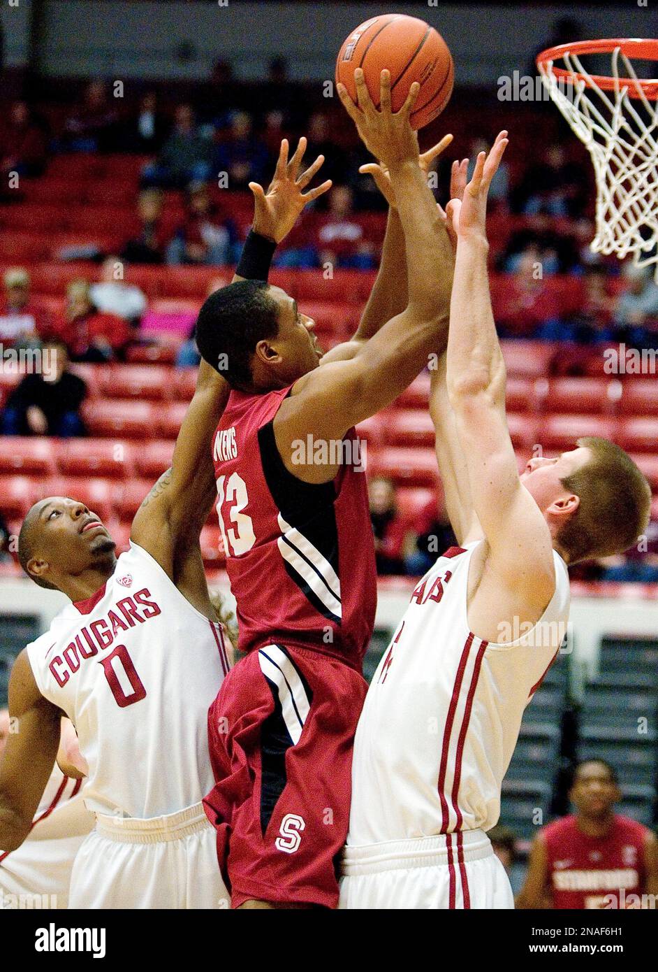 Stanford center Josh Owens (13) shoots between Washington State guard ...