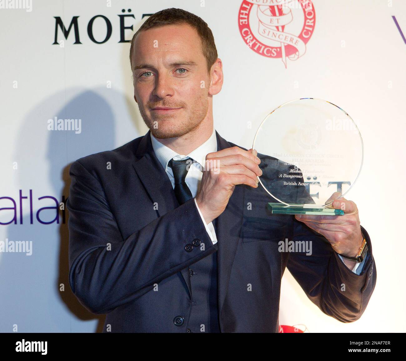 Michael Fassbender poses with his British Actor Of The Year Award ...
