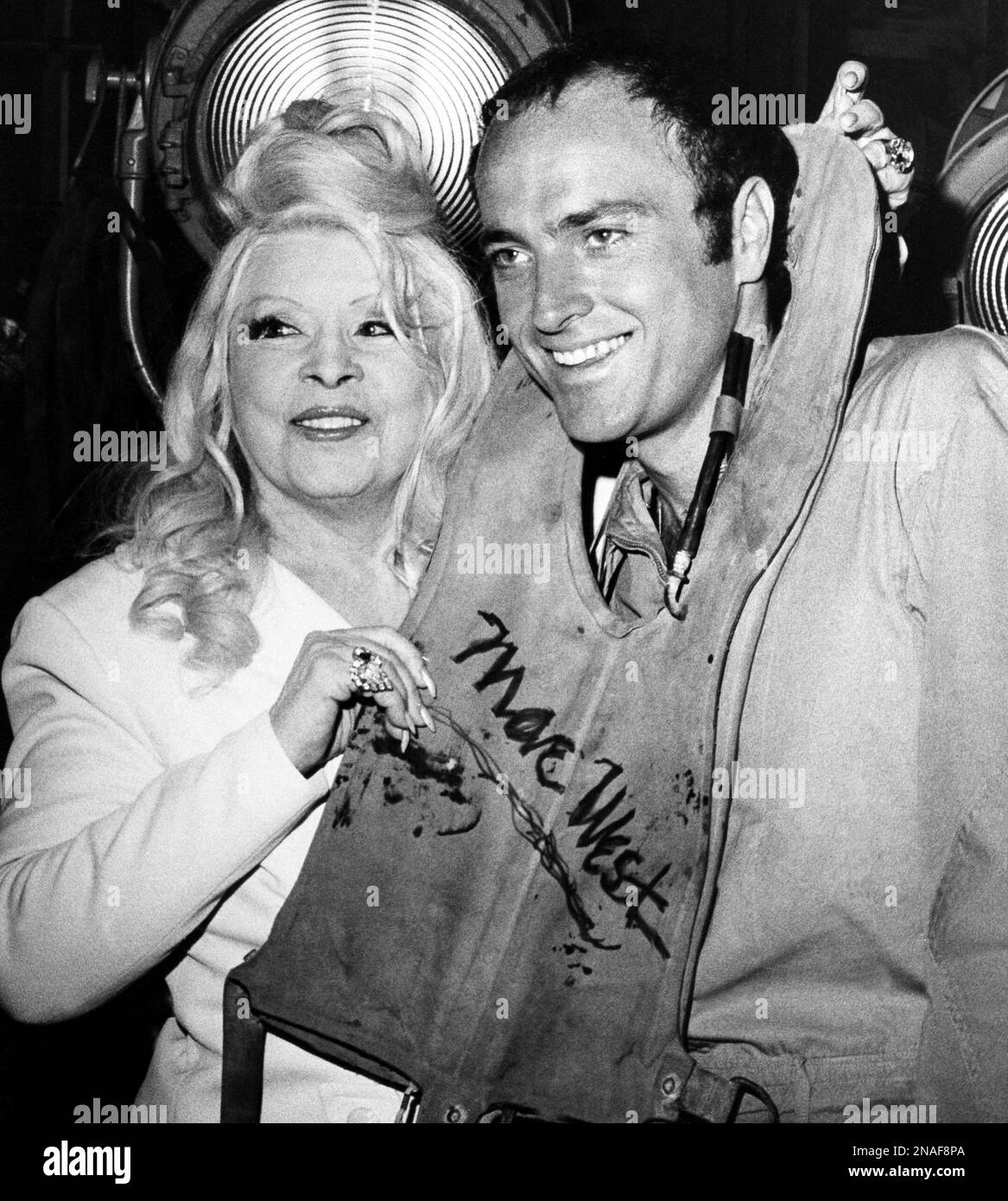 Mae West, visiting on the set of Universal's big-scale movie “Midway ...