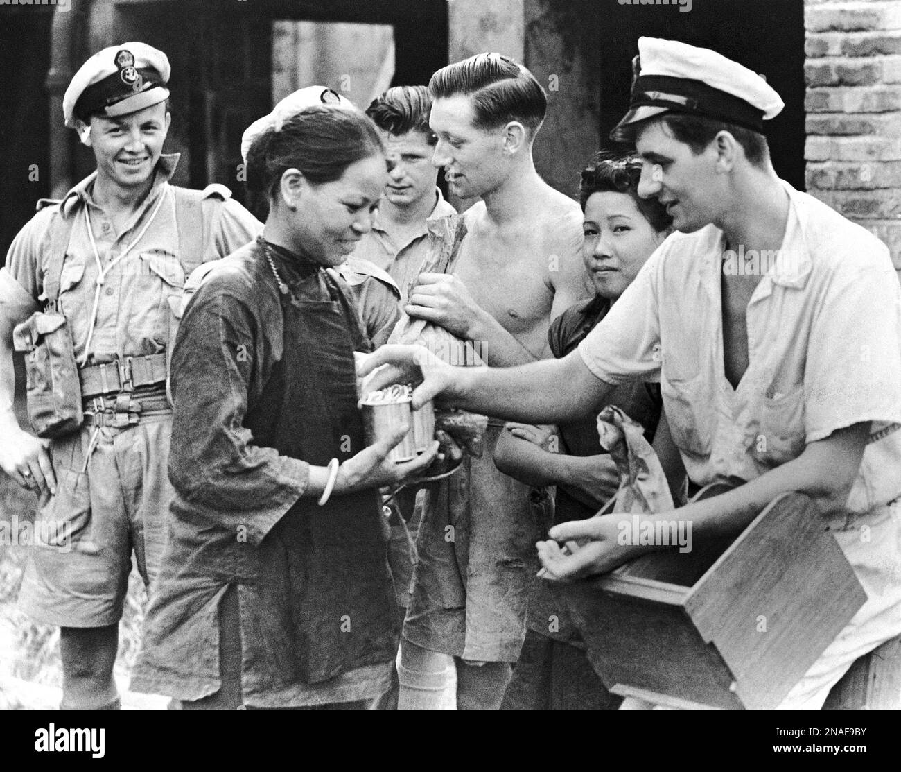 In Hong Kong a Chinese girl, the first to recommence work, is issued ...