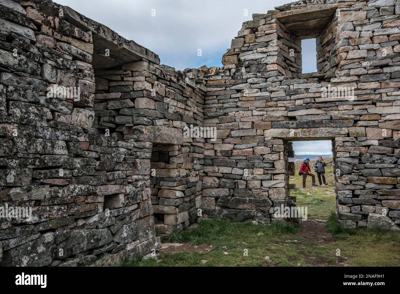 Visitors, to Greenland's archeological site of Hvalsey, where there is ...