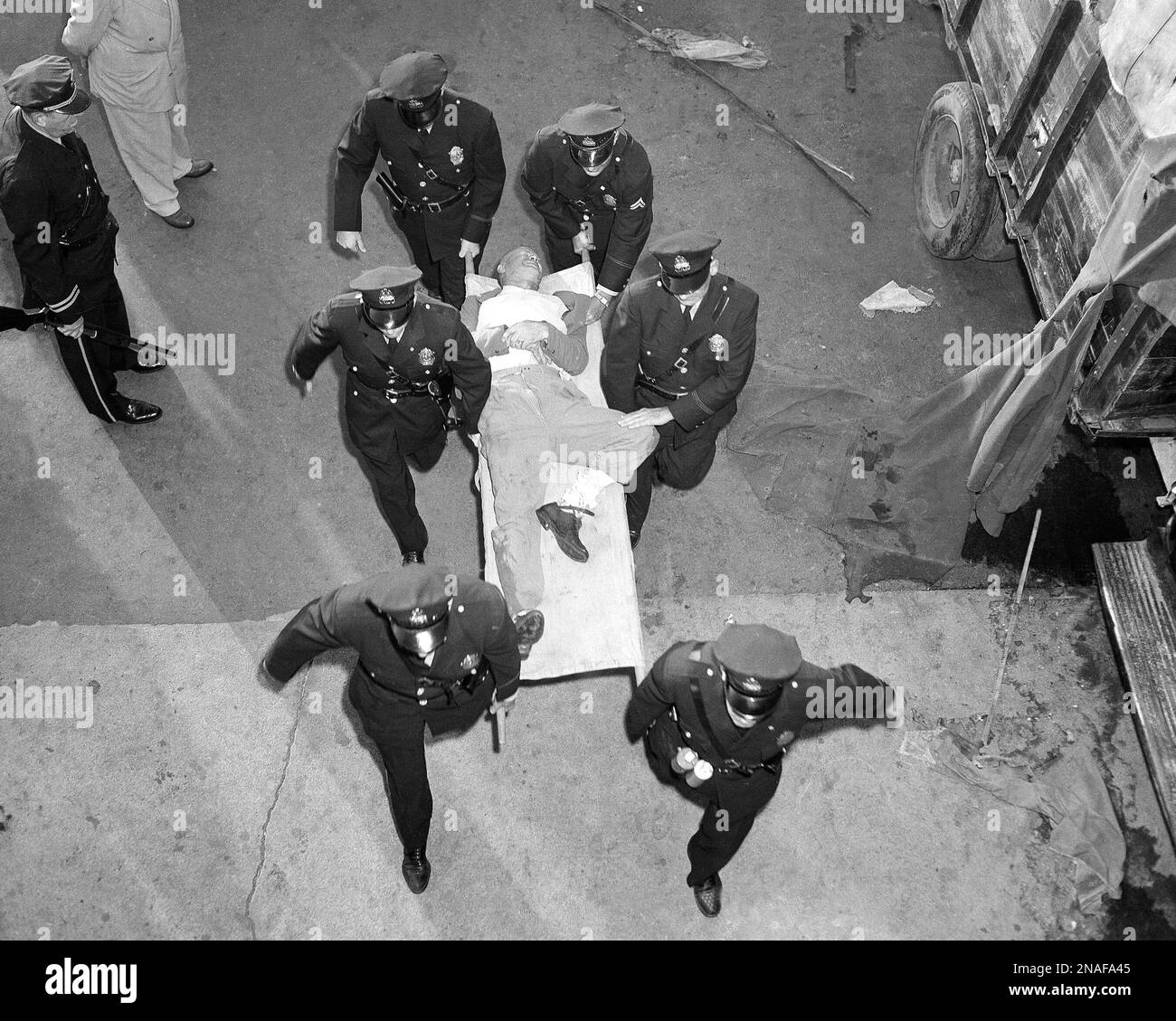 Six uniformed policemen carry wounded prison guard Clarence Dietzel of ...