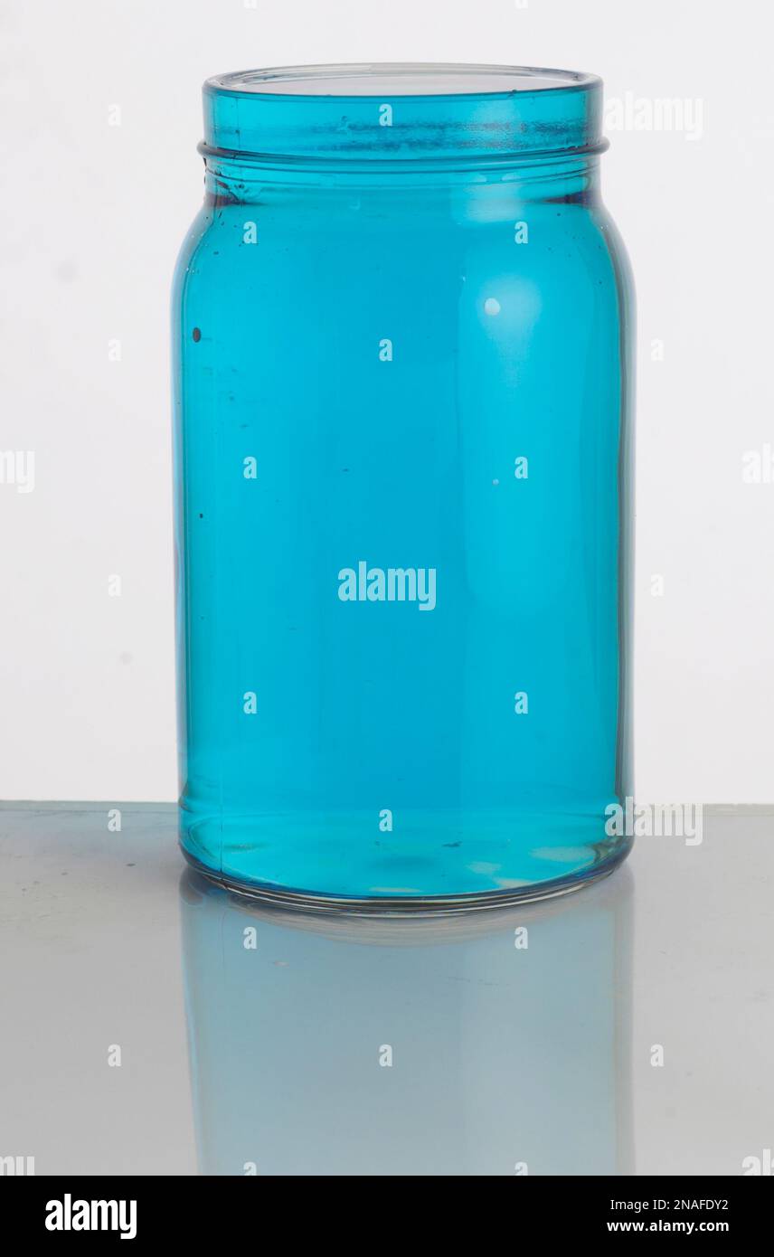 Jar of blue water Stock Photo - Alamy
