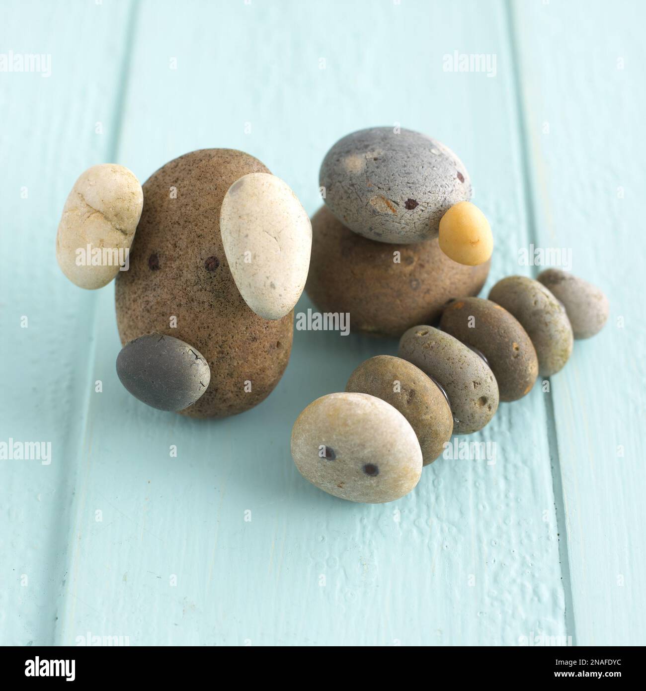 Toy animals made out of pebbles Stock Photo - Alamy