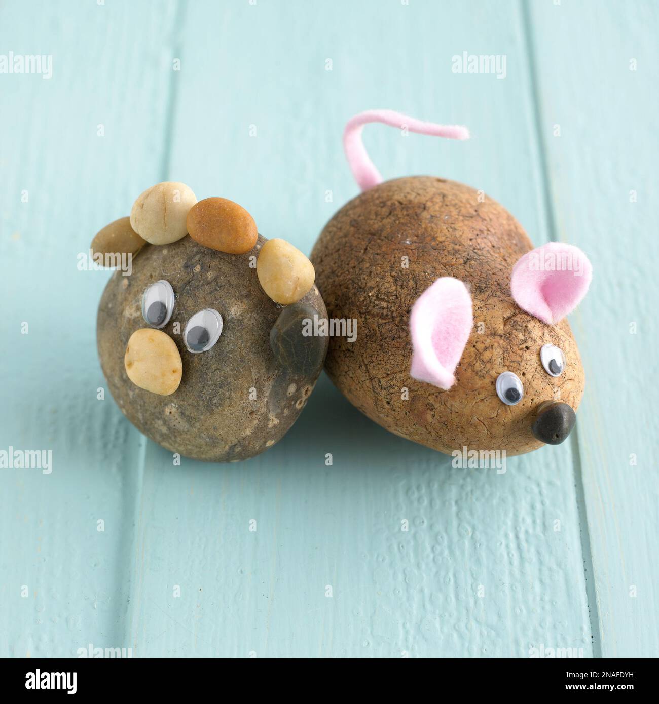 Toy animals made out of pebbles Stock Photo - Alamy