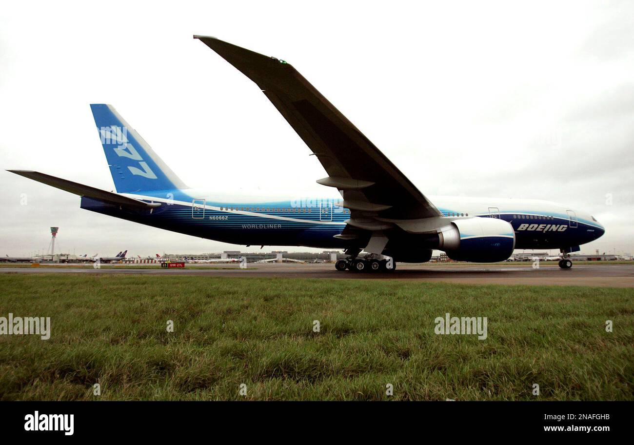 A Boeing 777-200LR lands at Heathrow Airport achieving its world record ...