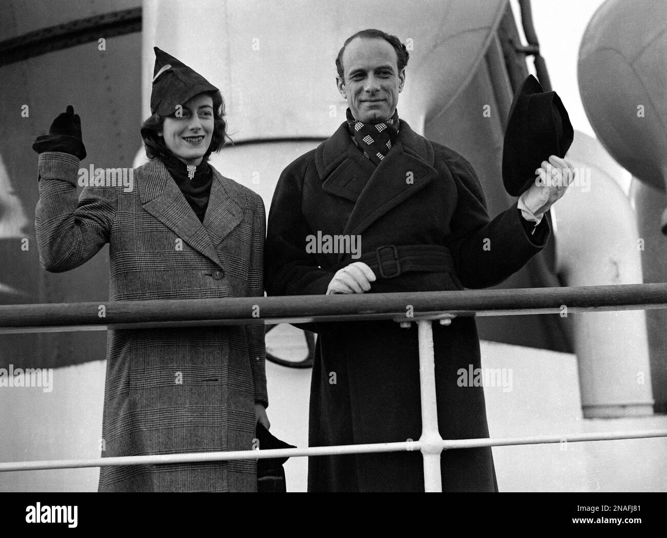 Sarah Churchill and her husband, Vic Oliver, waving to the crowd on ...