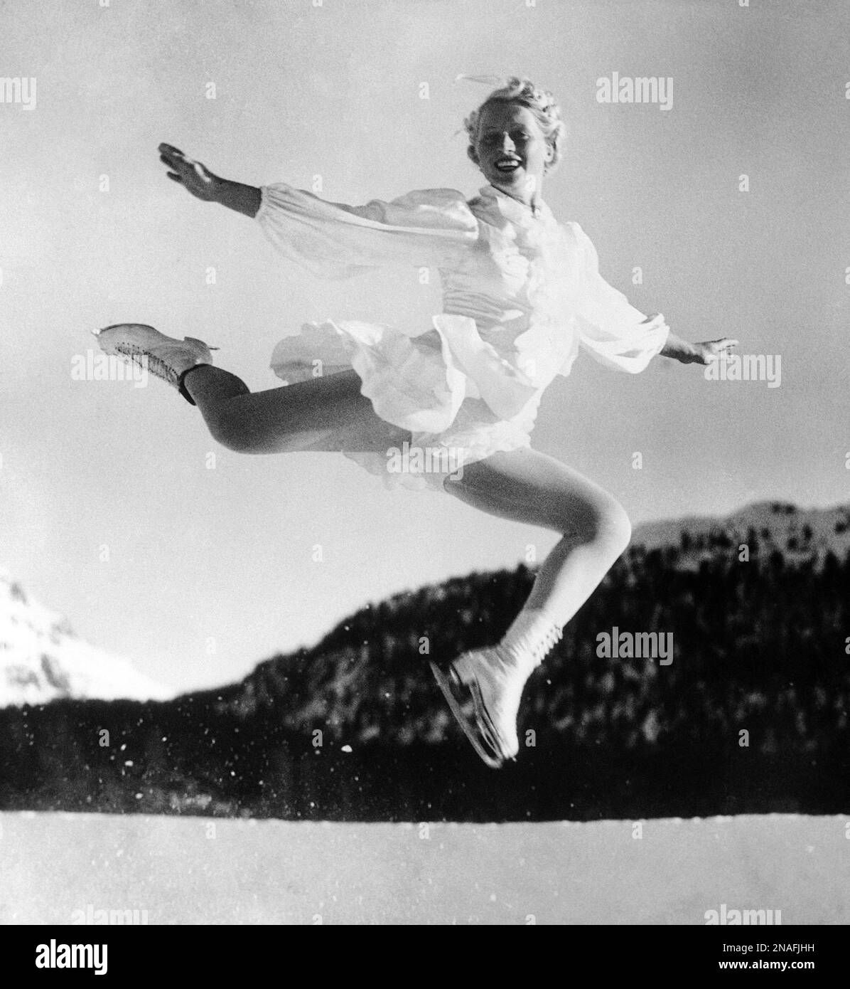 Melitta Brunner of Austria in action on the ice against a background of ...