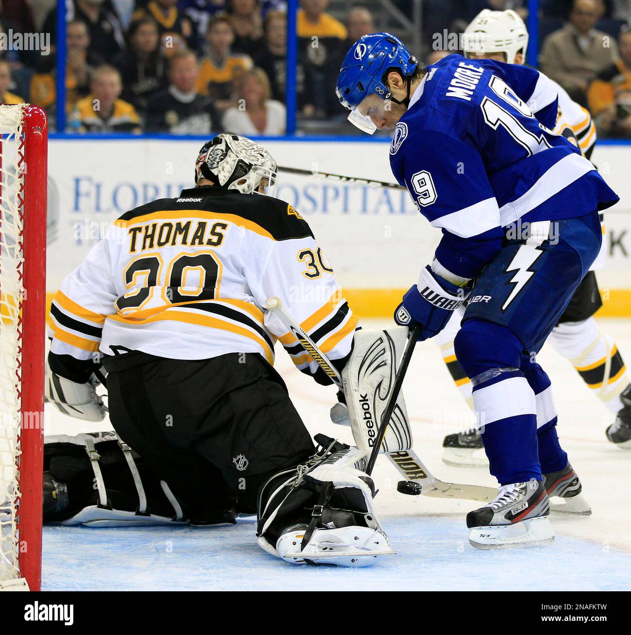 Tampa Bay Lightning center Dominic Moore (19) attepts to score past ...