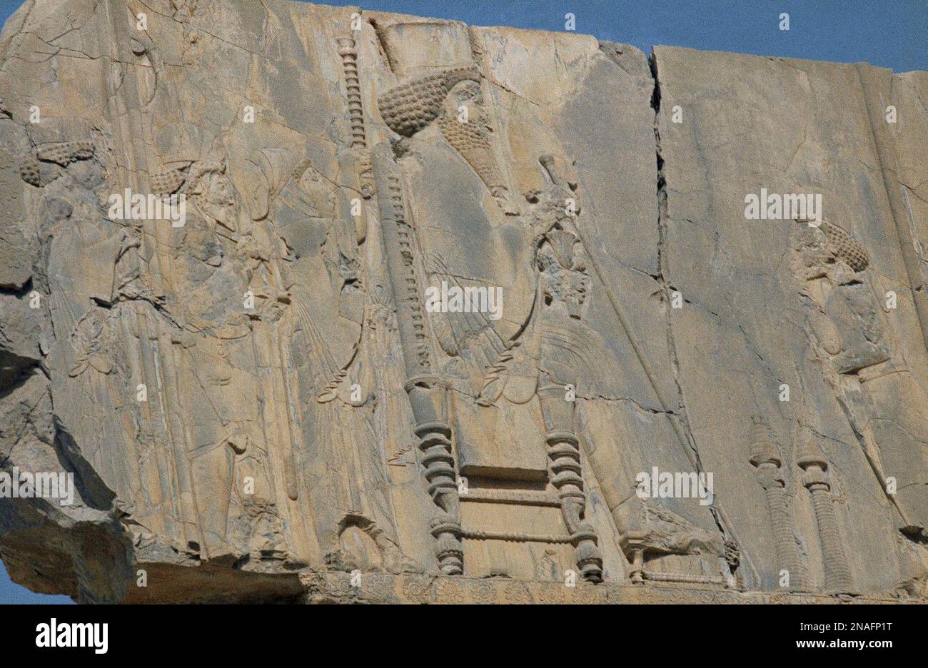 Stone carving of King Darius the Great on his throne, at the entrance ...
