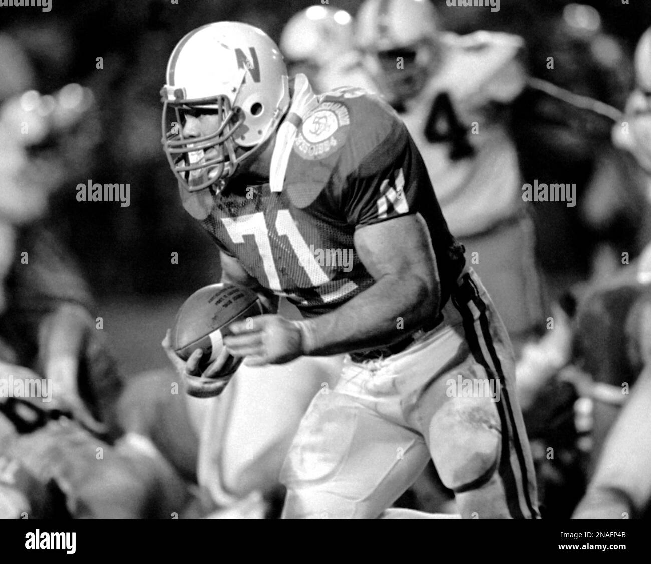 University of Nebraska offensive guard Dean Steinkuhler (71) to the ...