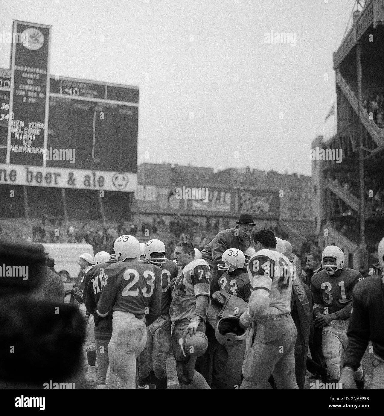 Players hoist Nebraska coach Bob Devaney to their shoulders to field at ...