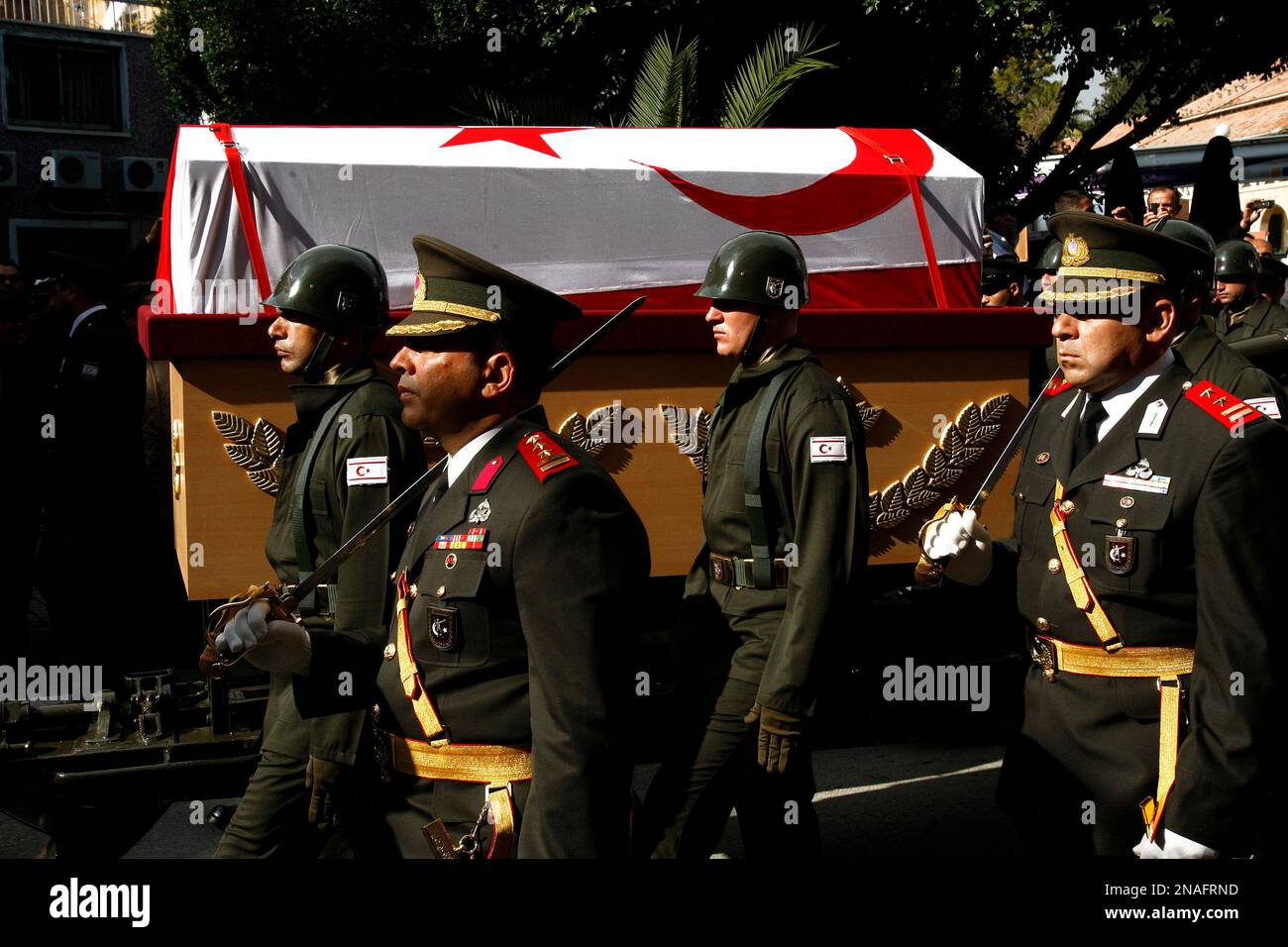 Turkish soldiers carry the coffin of former Turkish Cypriot leader Rauf ...