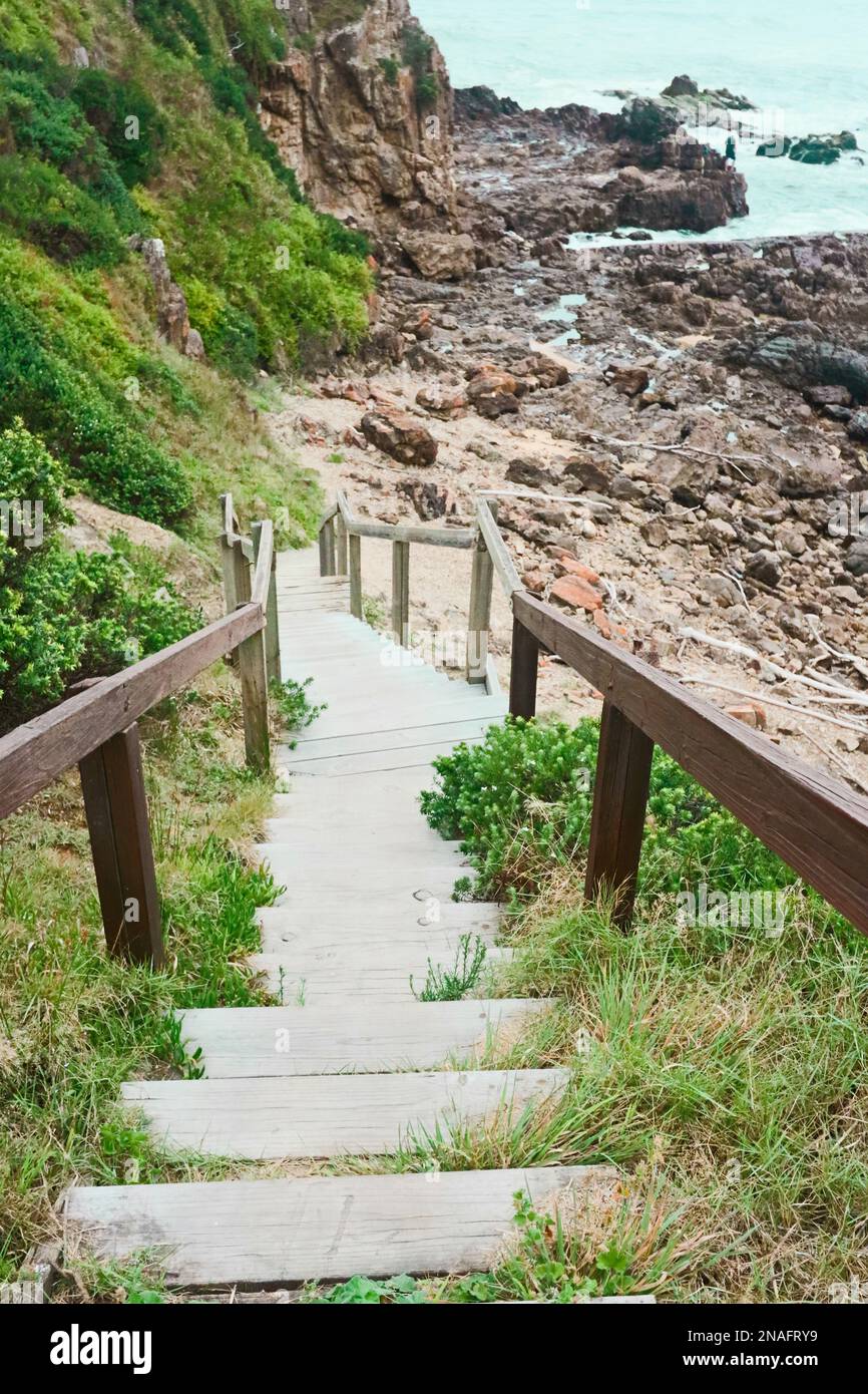 Beach stair track leading down to waters edge Stock Photo - Alamy