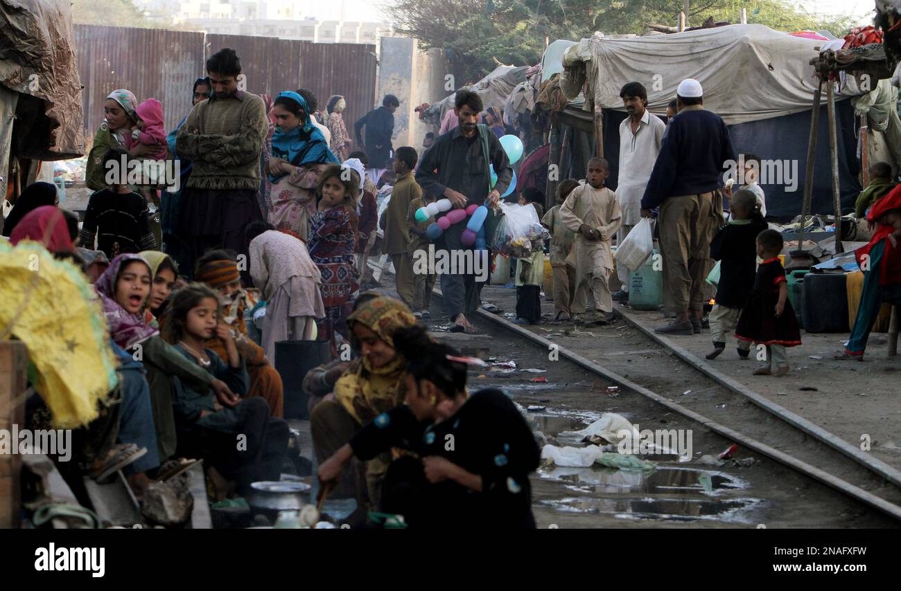 Pakistani poor families living along the railway track in Karachi ...