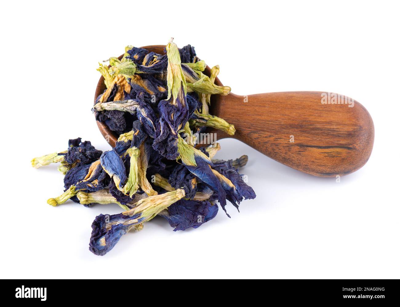 Butterfly pea flowers in wooden spoon, isolated on white background ...