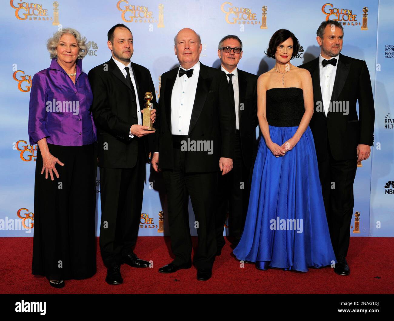 The cast and crew of "Downton Abbey" pose backstage with the award for ...