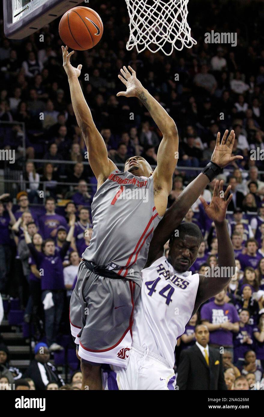 Washington's Darnell Gant (44) fouls Washington State's Reggie Moore in ...