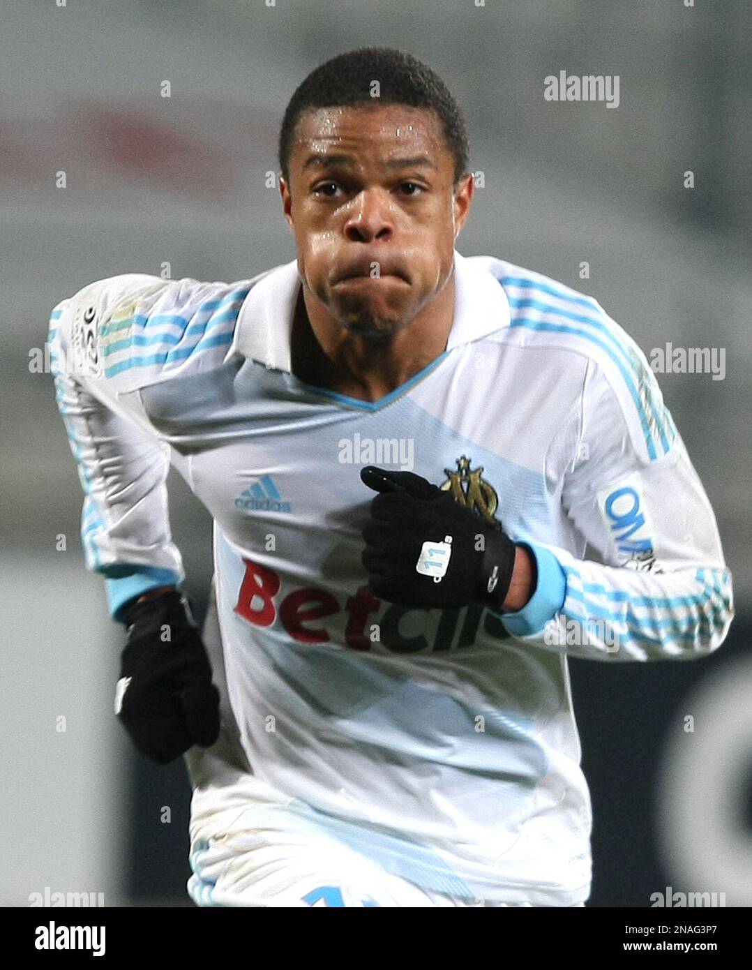 Marseille's French forward Loic Remy, left, reacts after scoring ...