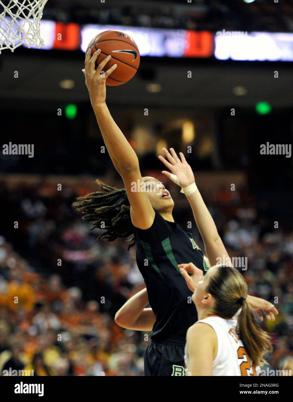 Baylor center Brittney Griner, left, pulls down a rebound against Texas ...
