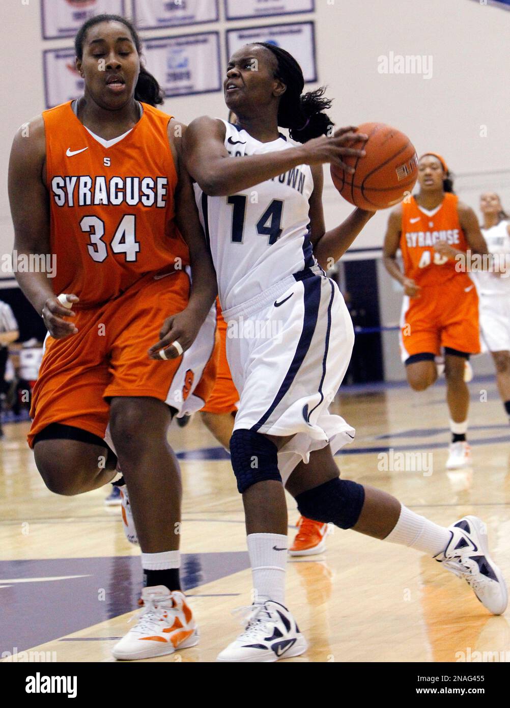 Georgetown guard Sugar Rodgers (14) drives against Syracuse center ...