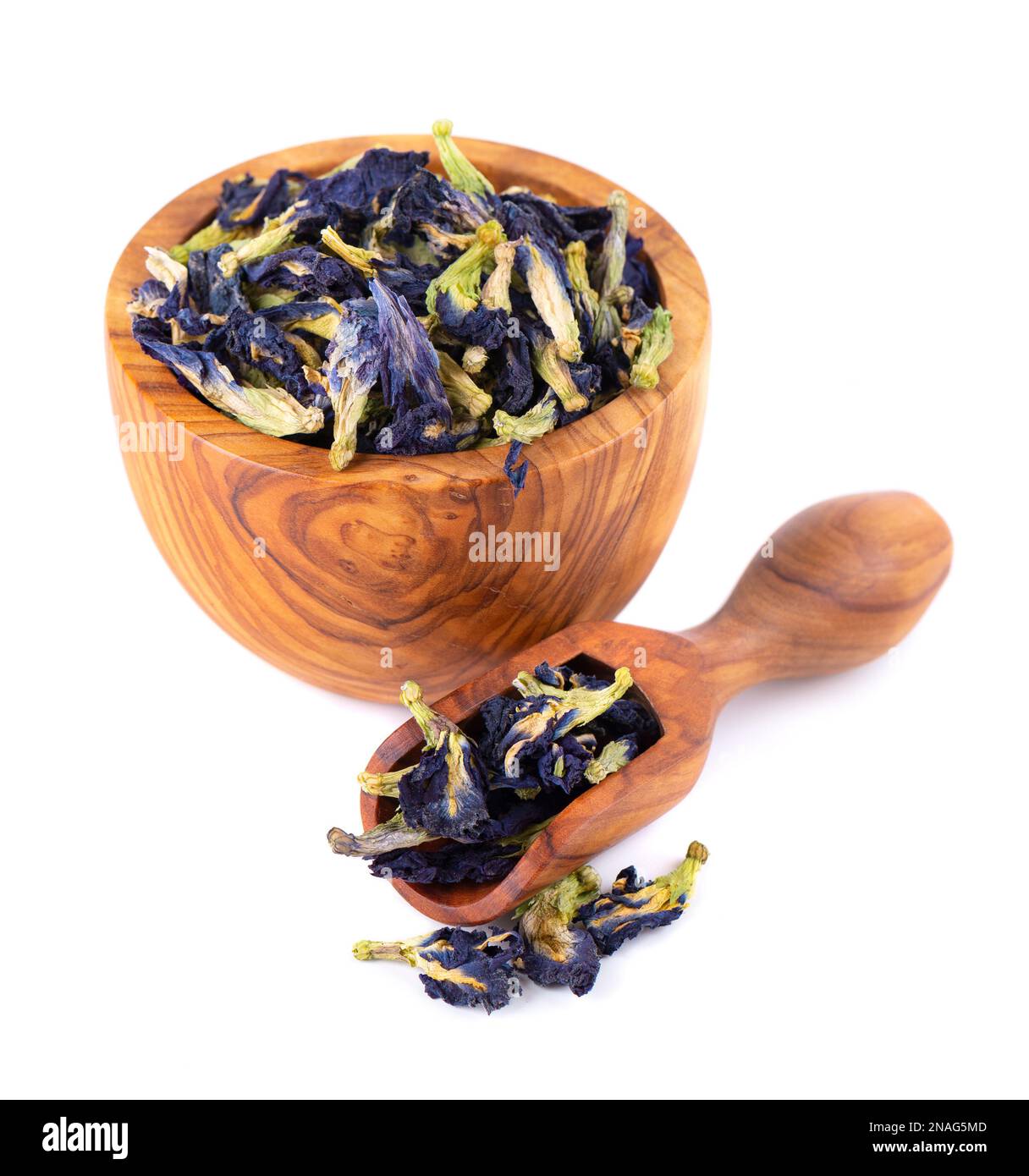 Butterfly pea flowers in wooden bowl and spoon, isolated on white ...