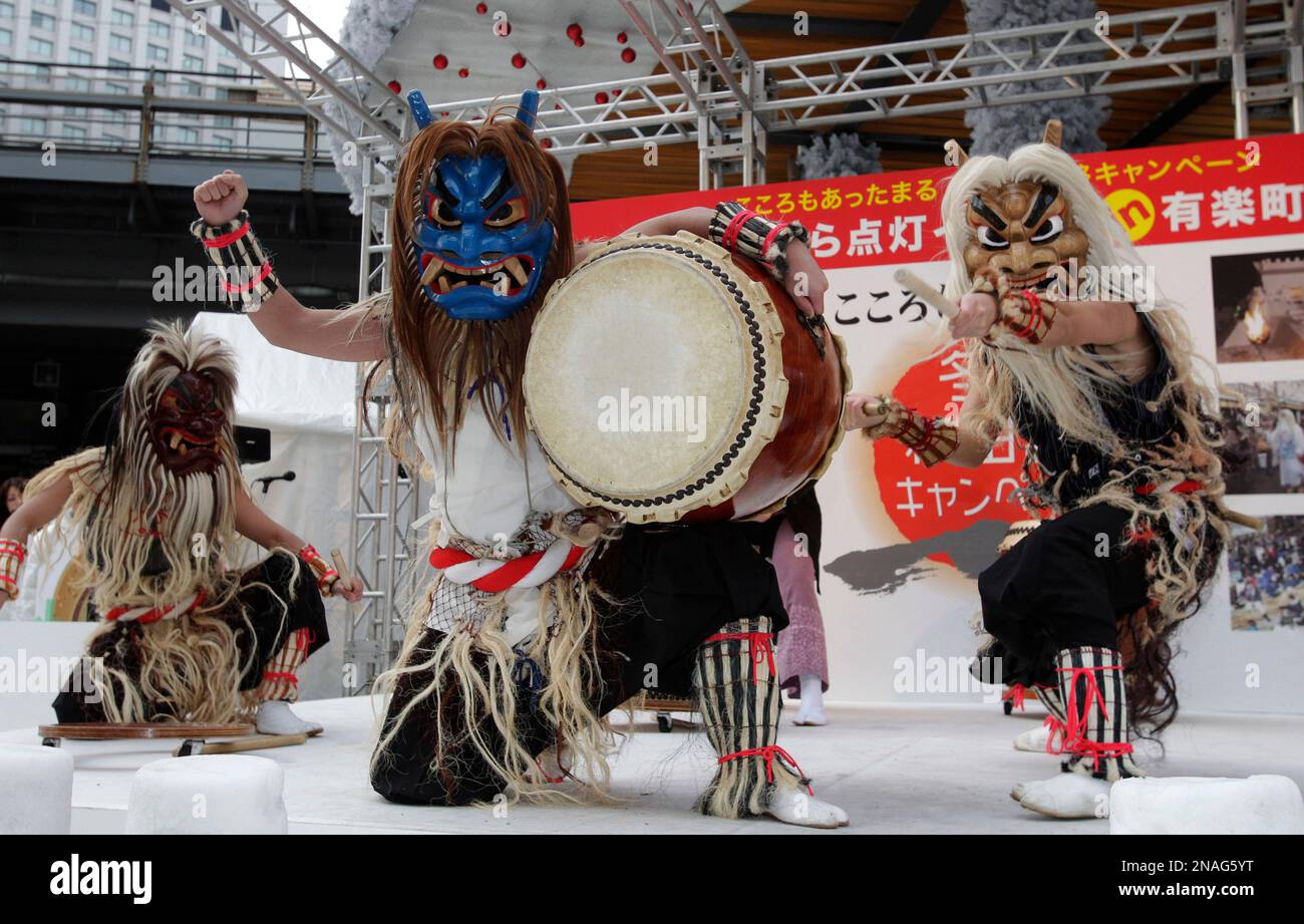 Traditional drummers wearing "Namahage," or ogres, costumes perform on ...