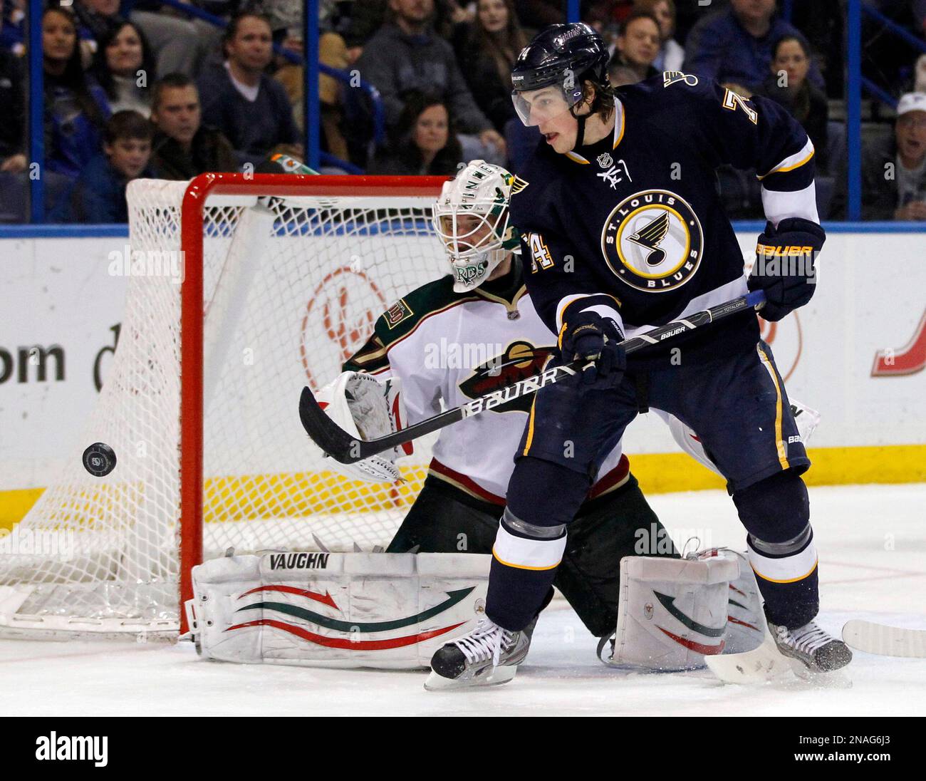 St. Louis Blues' T.J. Oshie, right, and Minnesota Wild goalie Josh ...