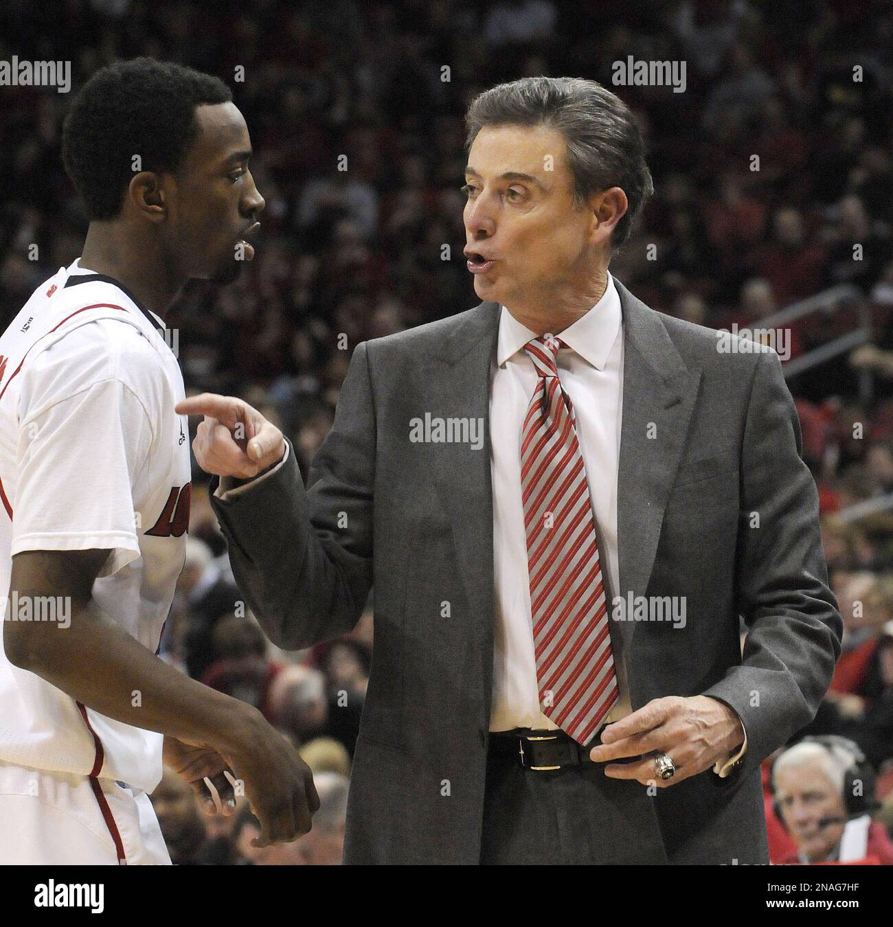 Louisville coach Rick Pitino, right, talks to Russ Smith during the ...