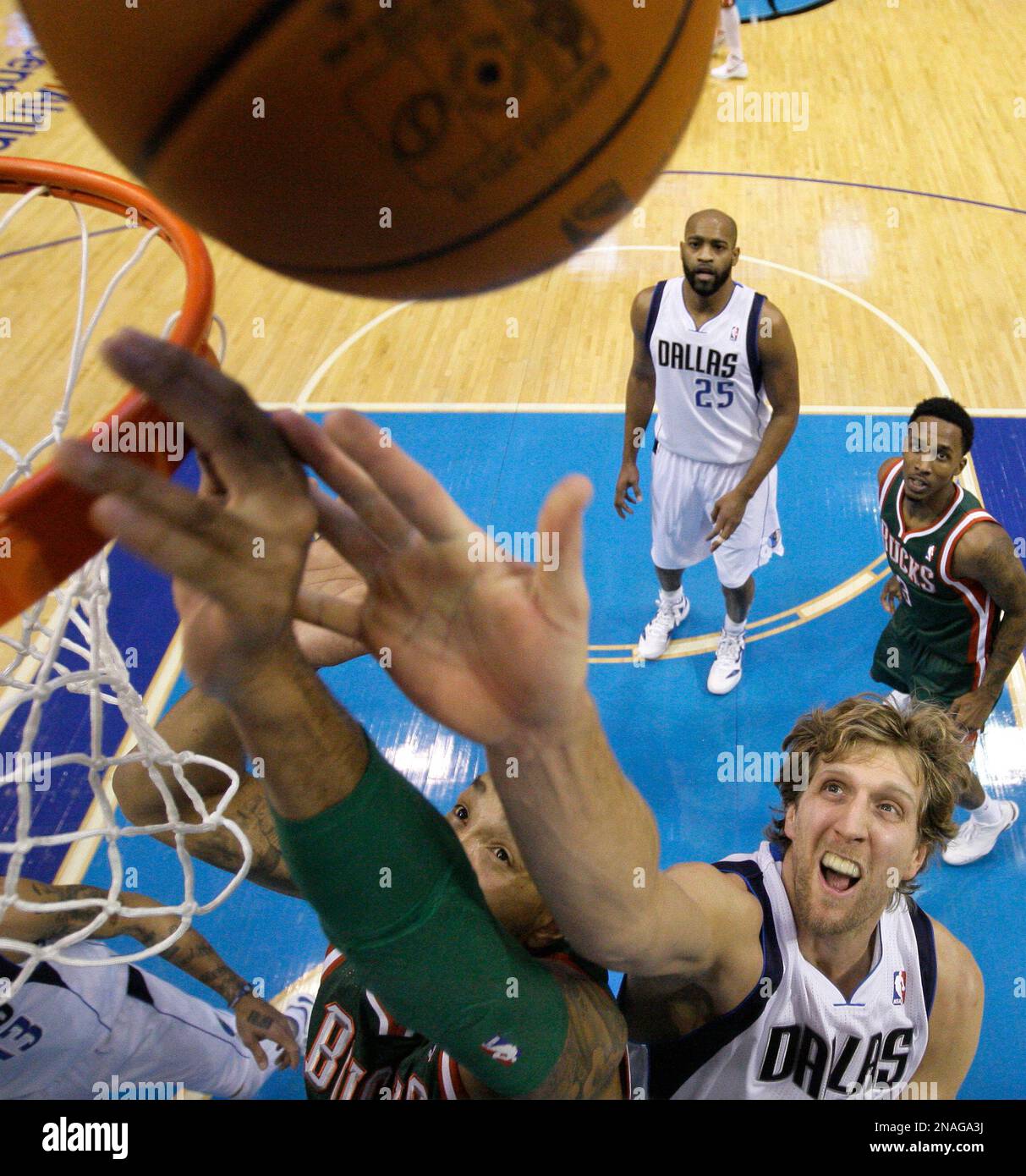 Dallas Mavericks' Dirk Nowitzki of Germany, right, and Milwaukee Bucks ...