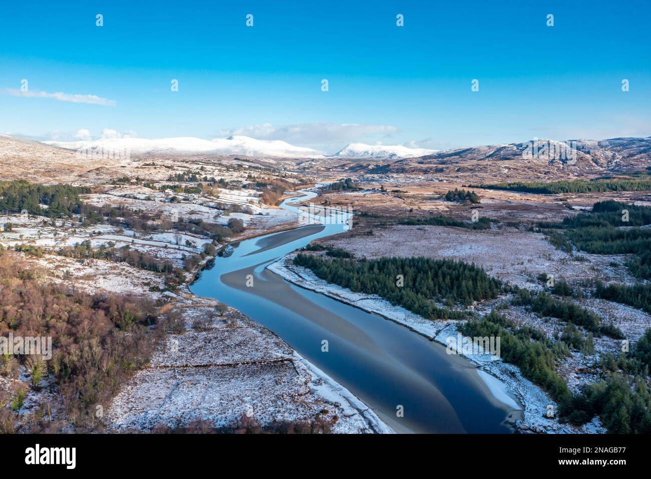 Aerial view of snow covered Gweebarra River between Doochary and ...