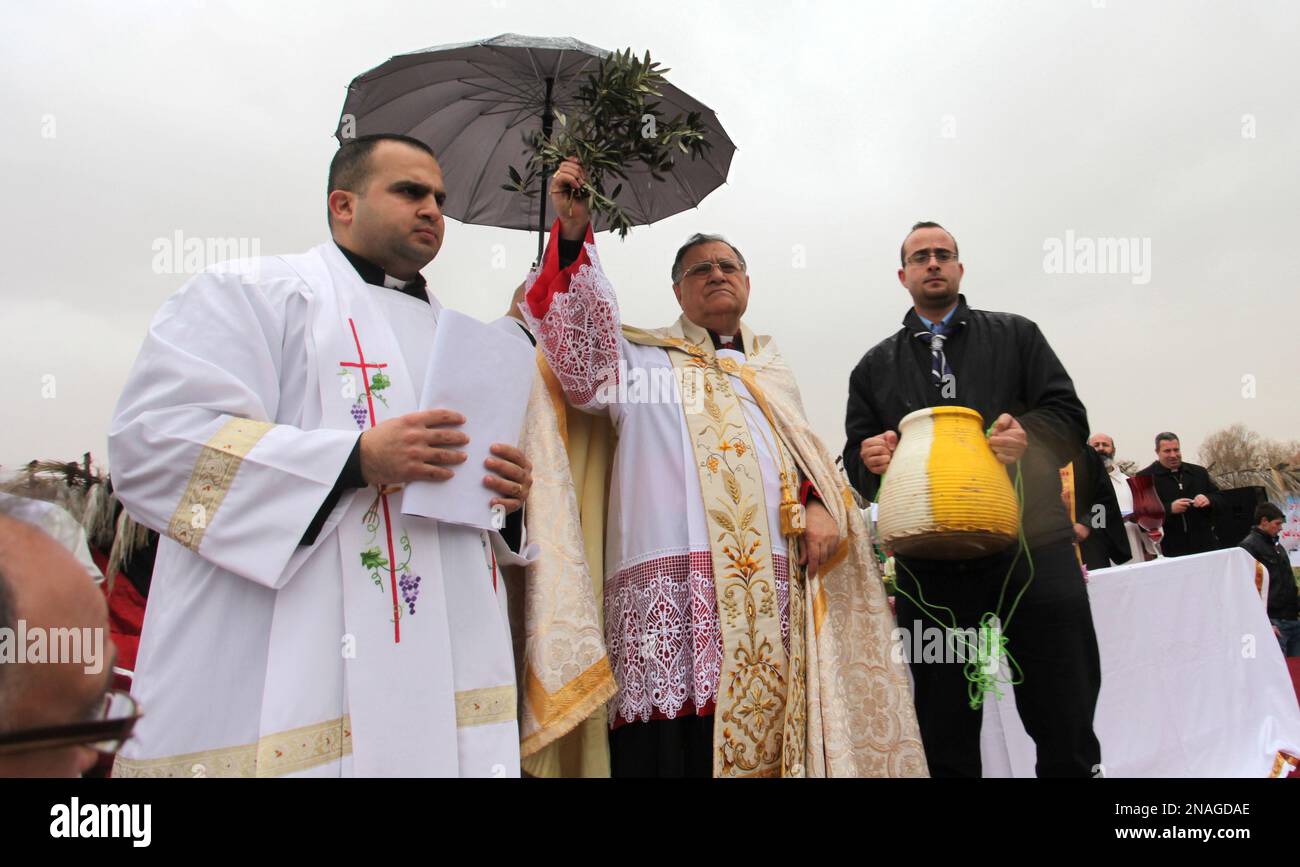 The Latin Patriarch of Jerusalem, Fouad Twal, sprays holy water at ...