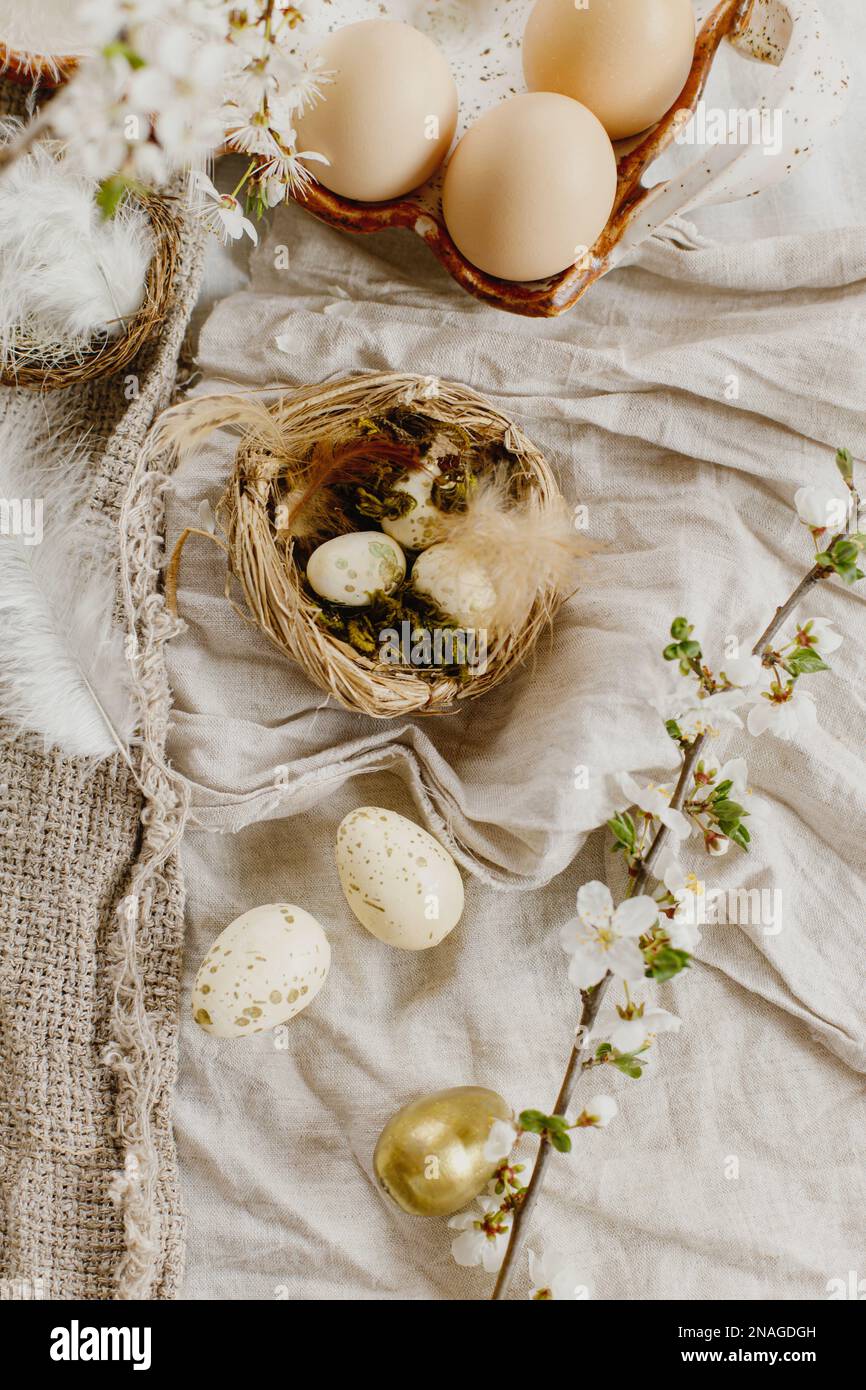 Happy Easter! Stylish easter eggs and blooming spring flowers on rustic ...