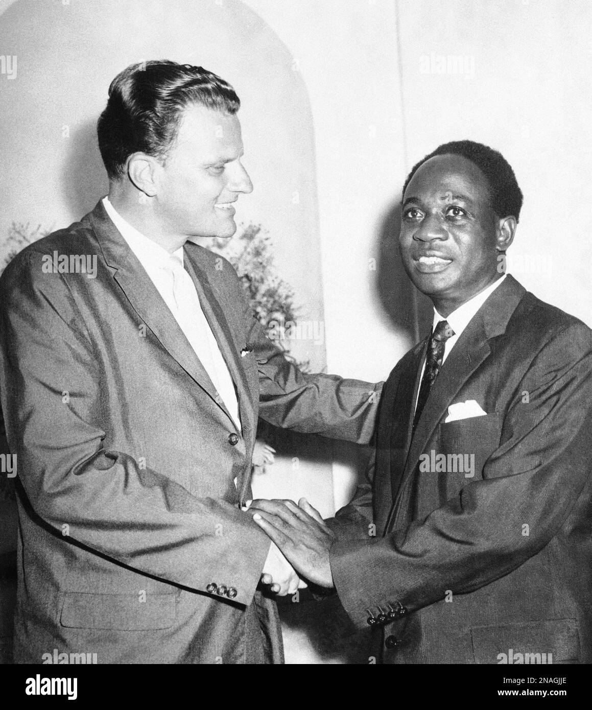 Billy Graham is greeted with a handshake by Dr. Kwame Nkrumah, prime ...