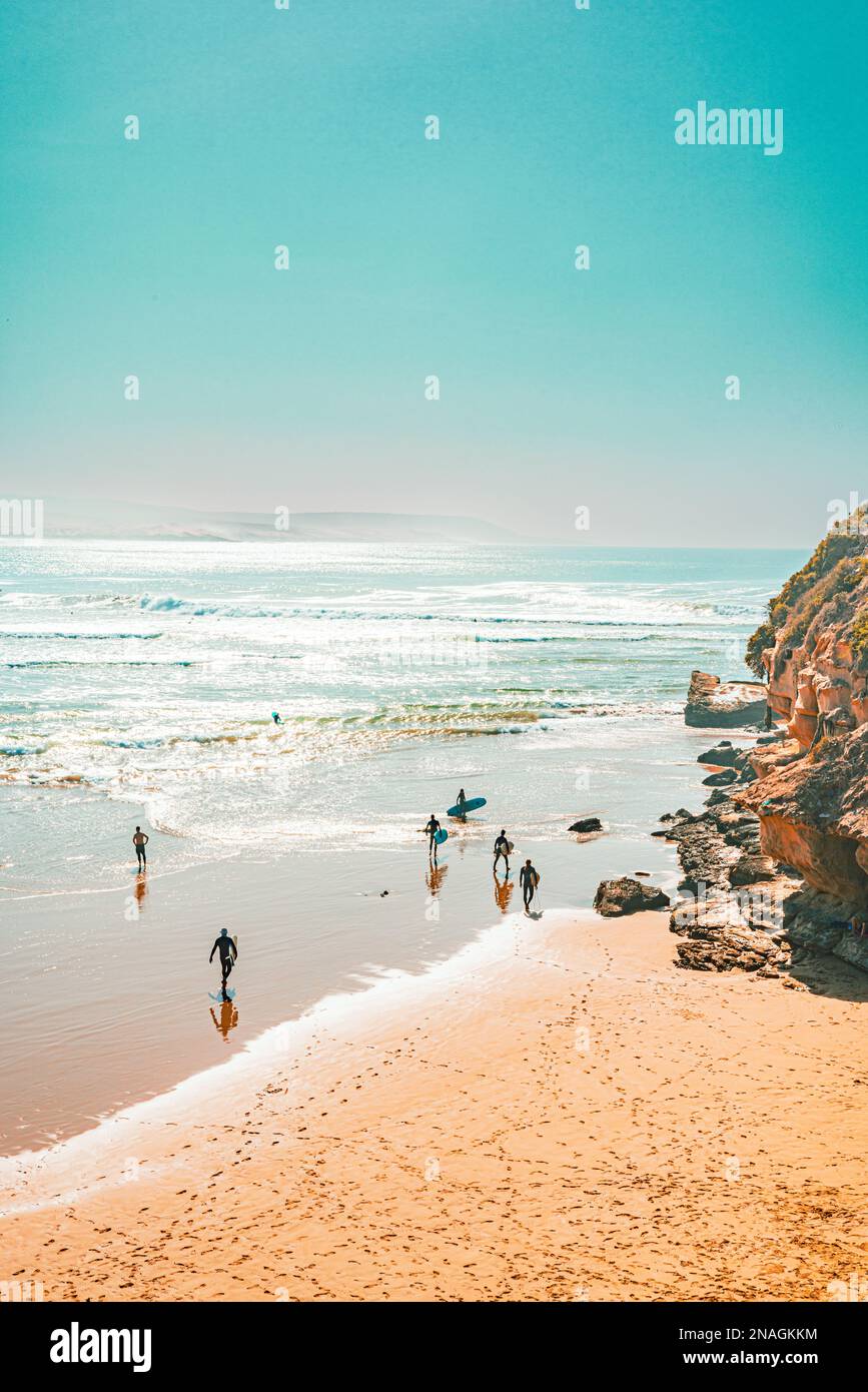 A group of people enjoying a sunny day at the beach Stock Photo - Alamy