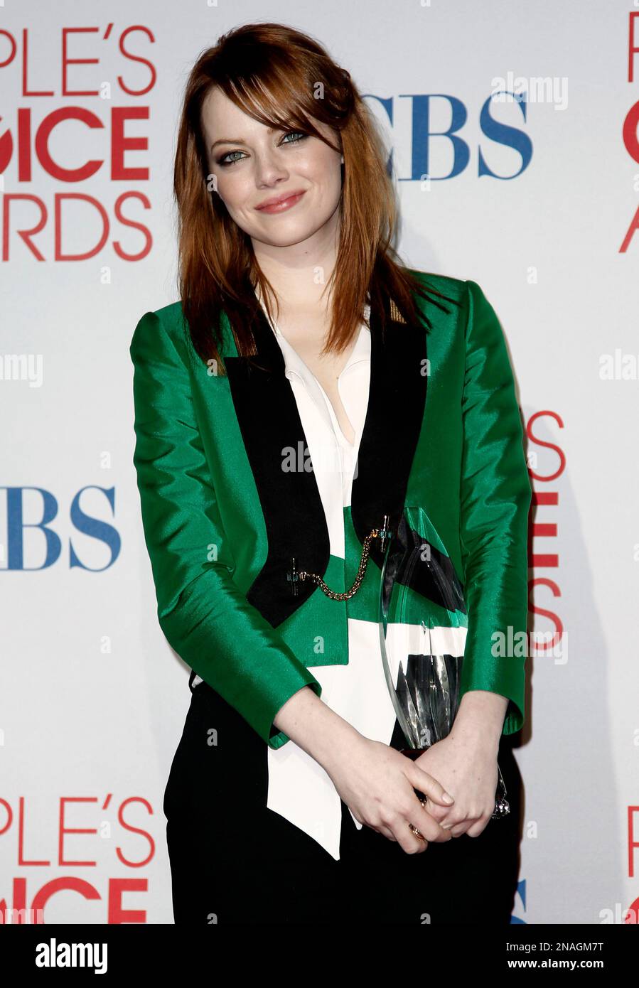 Emma Stone poses backstage with the award for favorite movie actress at ...