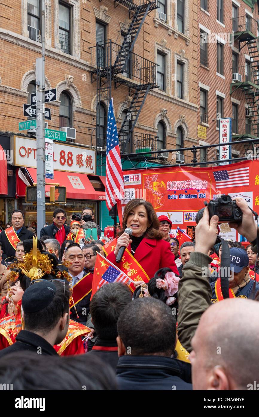 A group of people gathering together with flags and talking to each ...