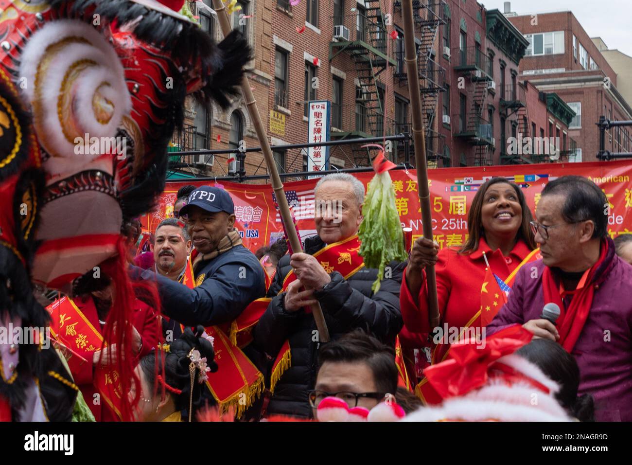 A crowd gathering around the head of a dragon during the parade Stock ...