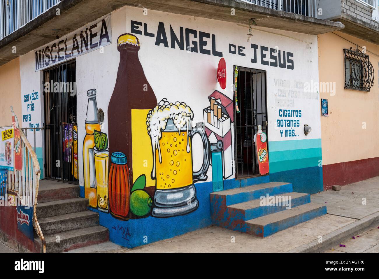 Colorfully painted walls of a corner shop in San Bartolo Coyotepec ...