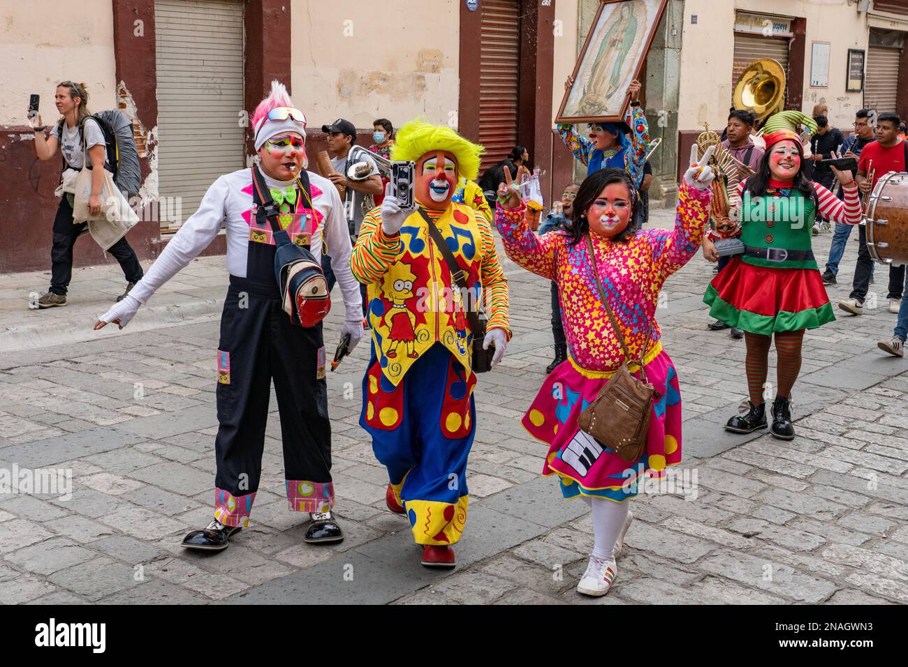 A parade of clowns on the Macedonio Alcala pedestrrian street in the ...