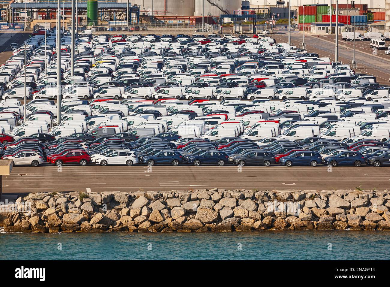 New vehicles in parking lot ready to be shipped. Motor industry Stock ...