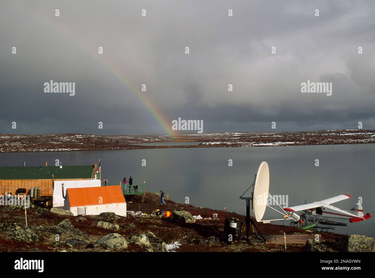 Diamond mining camp with floatplane, satellite dish and buildings, and ...