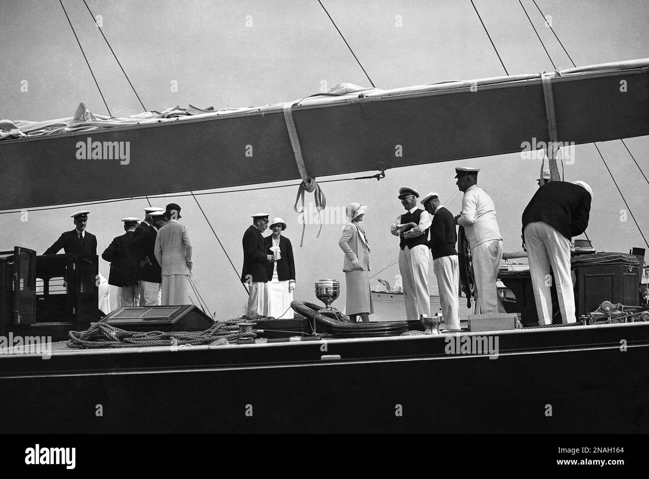Britain's Duchess of York, Elizabeth Bowes Lyon talking with Sir Philip ...