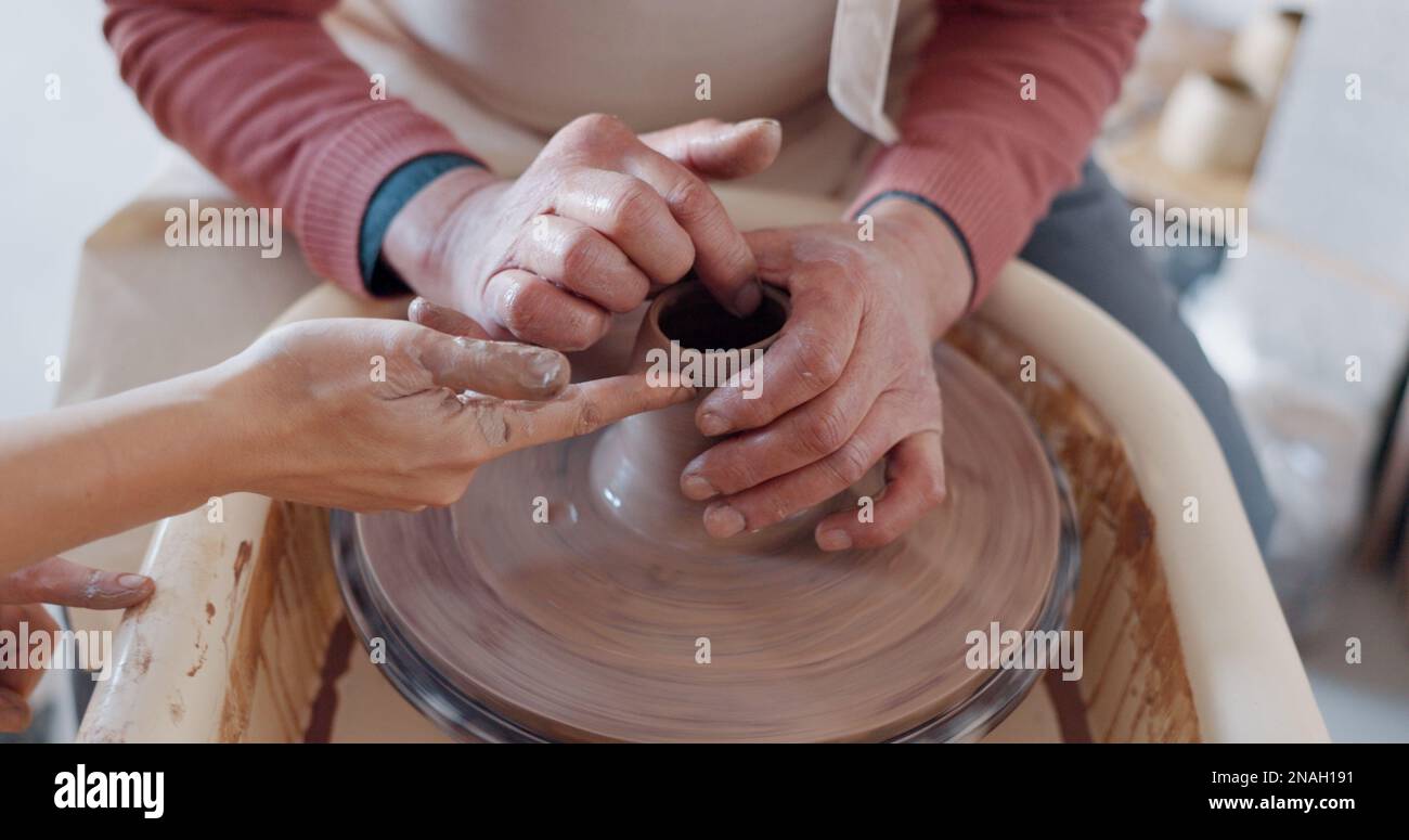 Hands, pottery and clay with a man student learning from a female ...