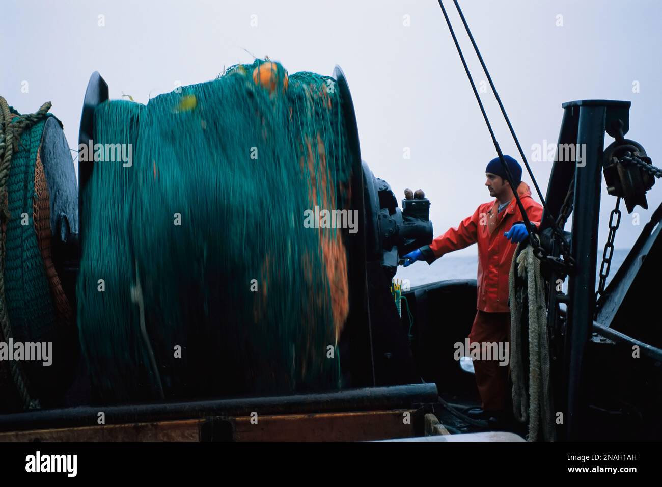 Fishing crew with their bottom trawling net in the waters of Clayoquot ...