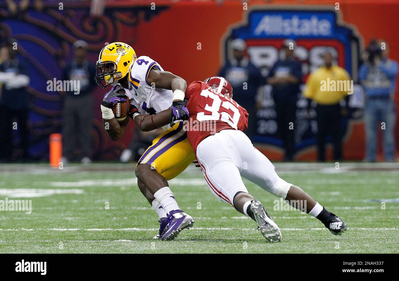 LSU running back Alfred Blue (4) is hit by Alabama linebacker C.J ...