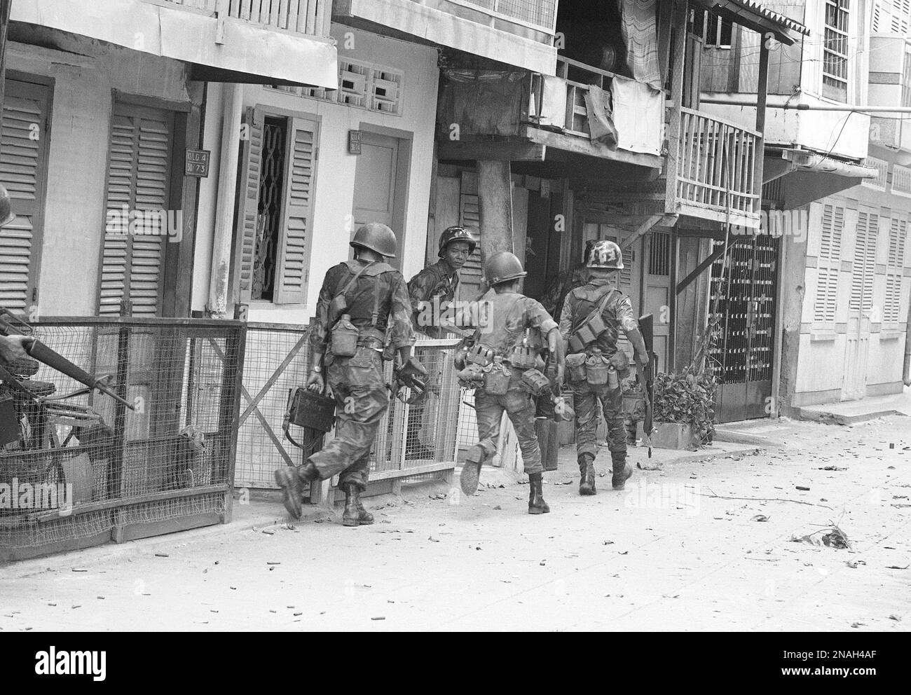 South Vietnamese soldiers run to cover following an early morning ...