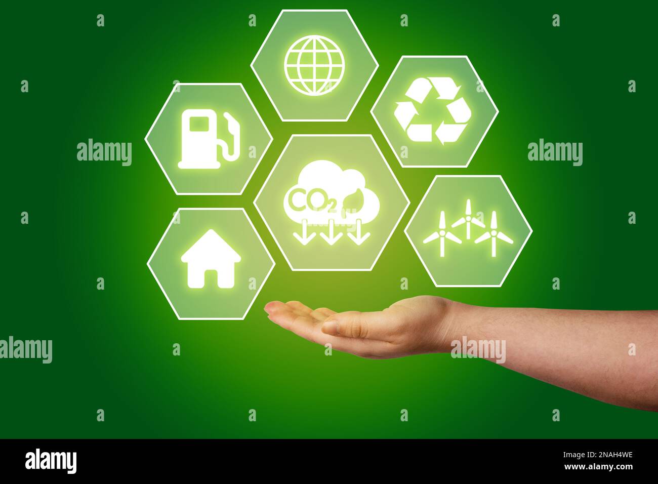 Woman hand showing eco life hologram interface. Reduce CO2 emissions to ...