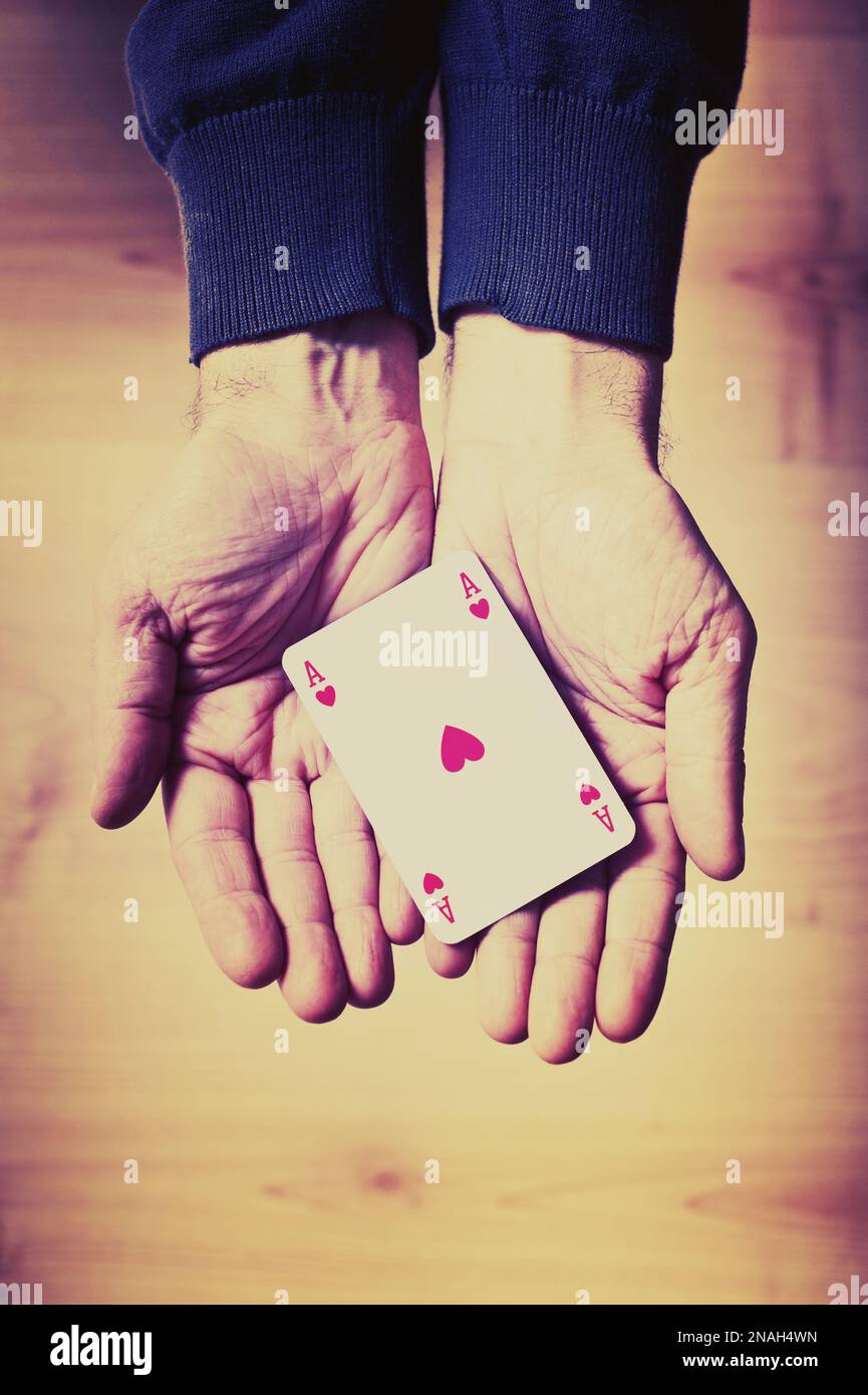 man open hands holding a ace of Hearts playing card Stock Photo - Alamy