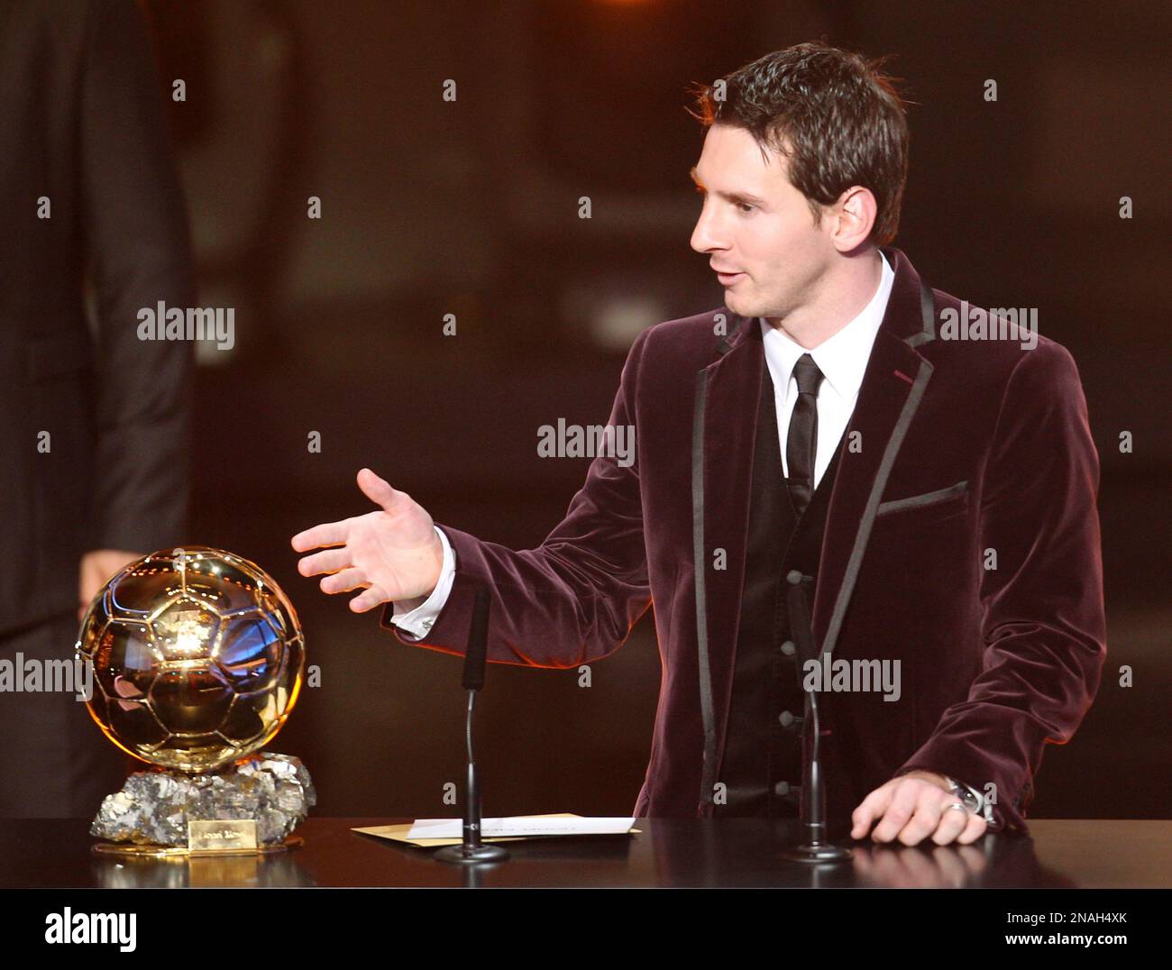 Argentina's Lionel Messi is awarded the prize for the soccer player of ...